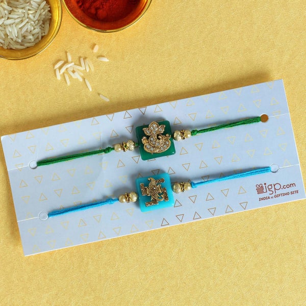 Ganesha and Swastik Design Rakhi Set of 2 : Gift/Send Rakhi Gifts ...