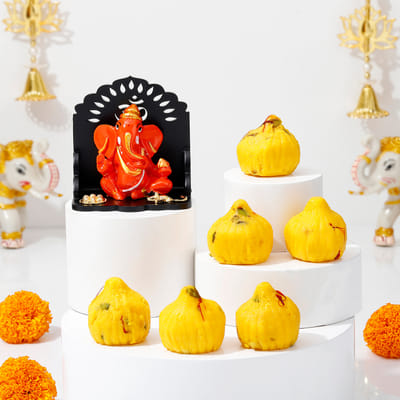 Buy/Send Ecstatic Ganesha Statue And Kesar Pista Modak Combo Online ...