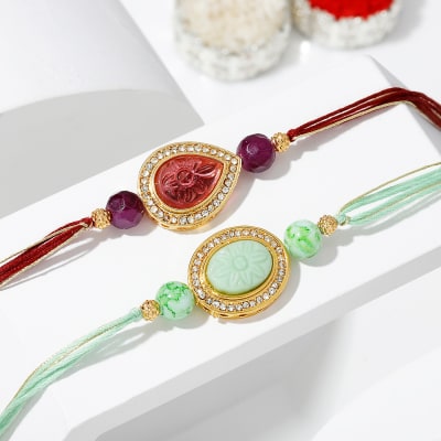 Buy/Send Enchanting CZ And Stone Rakhi Set Of 2 Online | IGP | JVS1285674