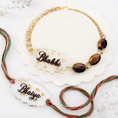 Graceful Bhaiya Bhabhi Resin Rakhi: Gift/Send Rakhi Gifts Online ...