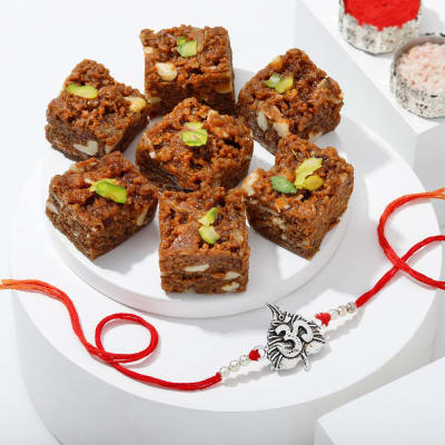 Buy/Send Om Metal Rakhi And Delicious Sweets Combo Online | IGP ...